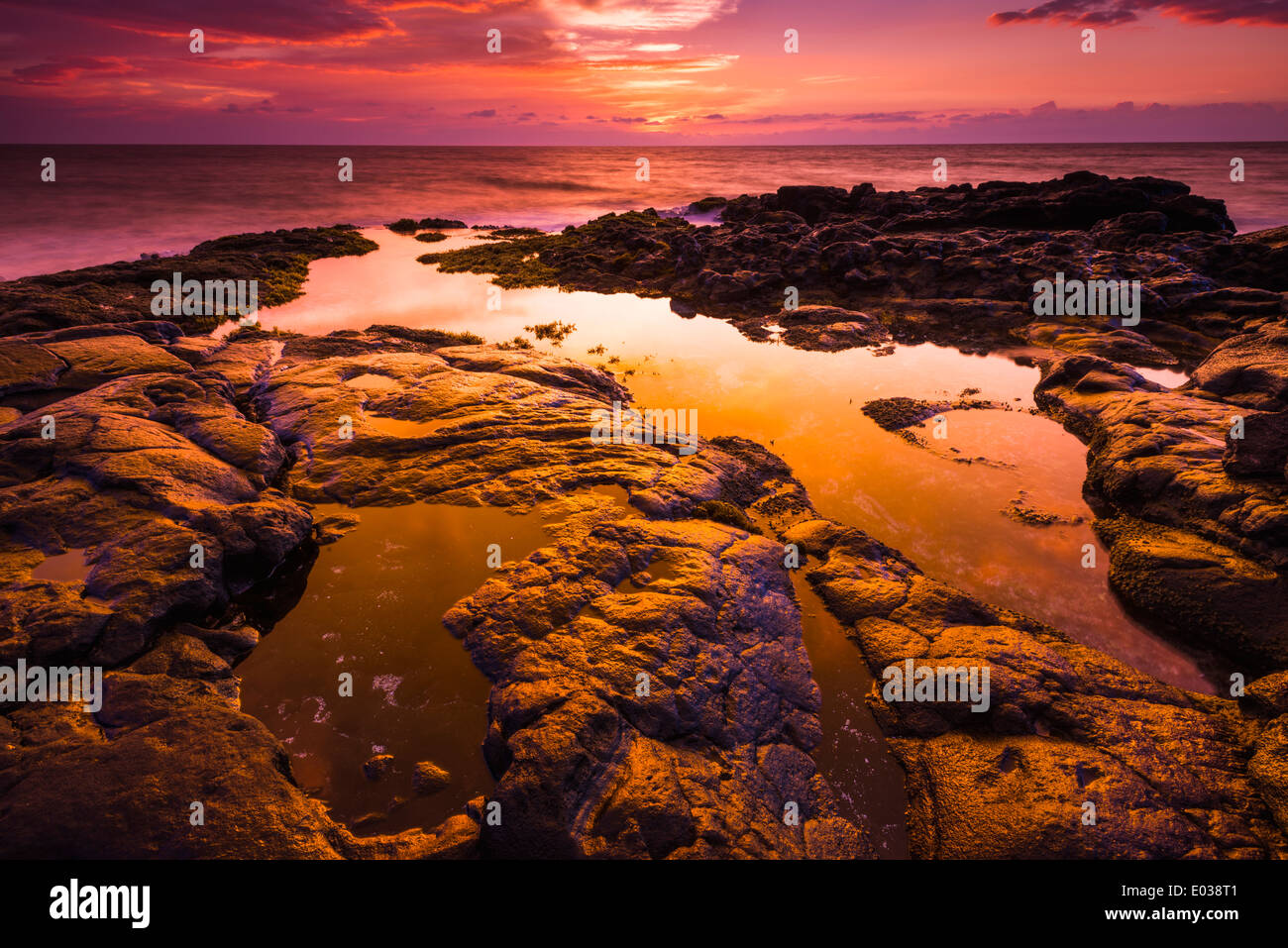 Tidepool reflection of sunset and clouds hi-res stock photography and ...