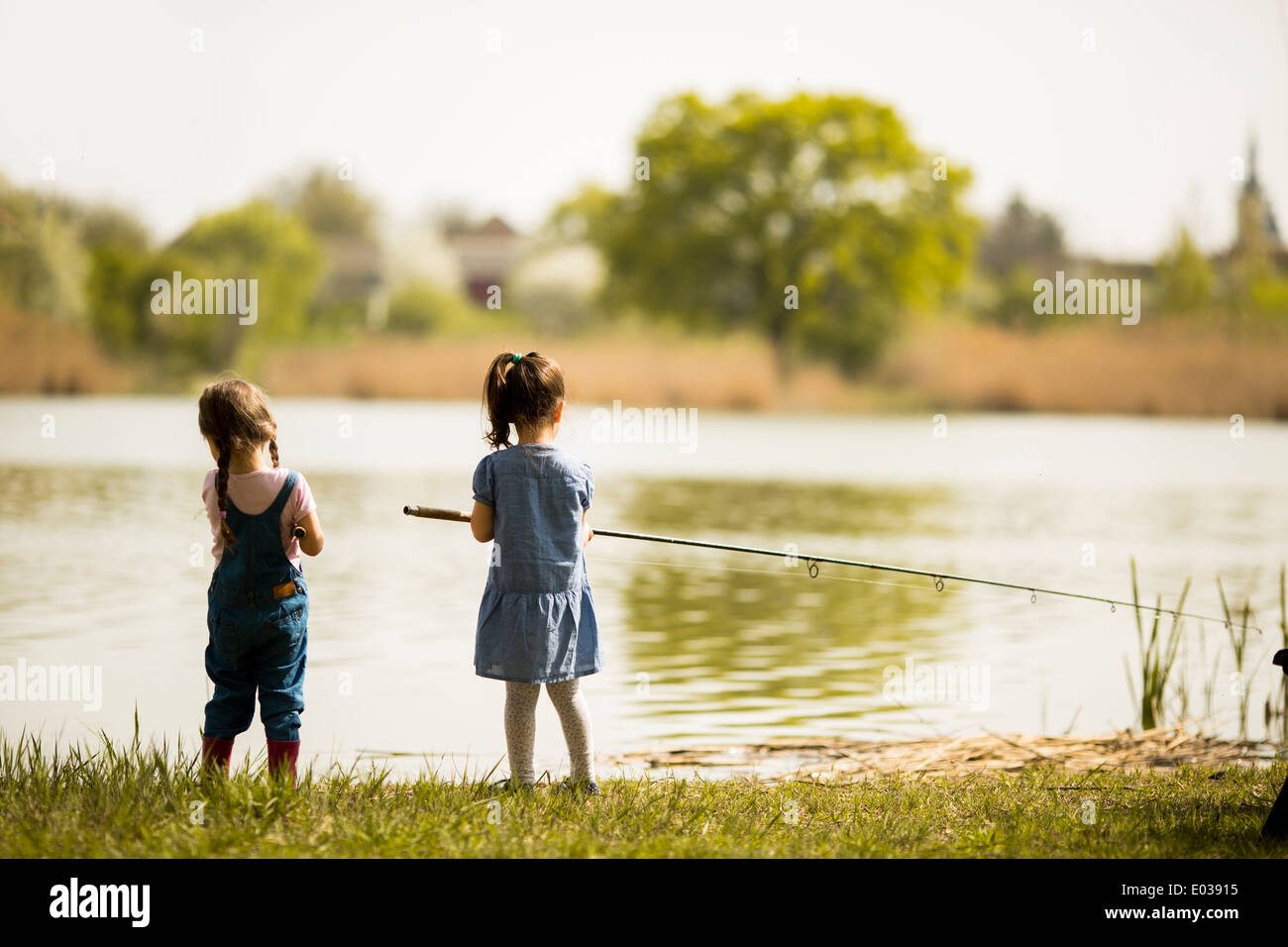 Kid child fishing with stick hi-res stock photography and images - Alamy