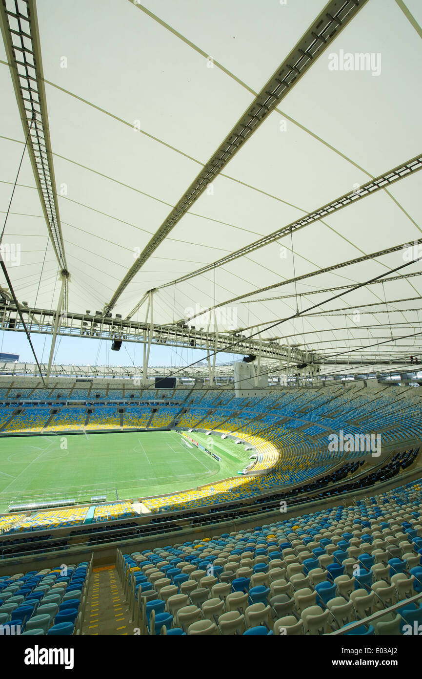 Empty blue and yellow stadium seating at Maracana football stadium Rio ...