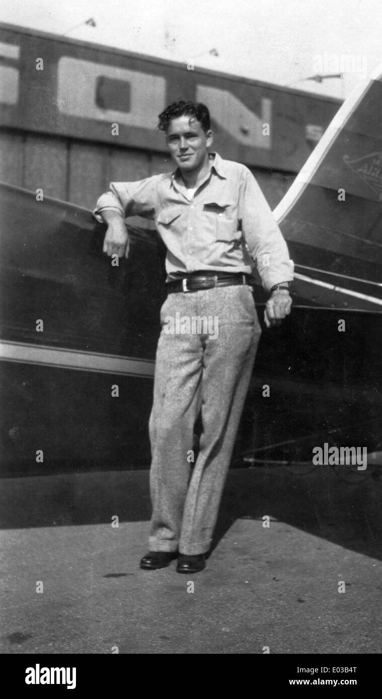 Robert Mitchell, a prominent figure in aviation history, was photographed with the Stinson SM ...