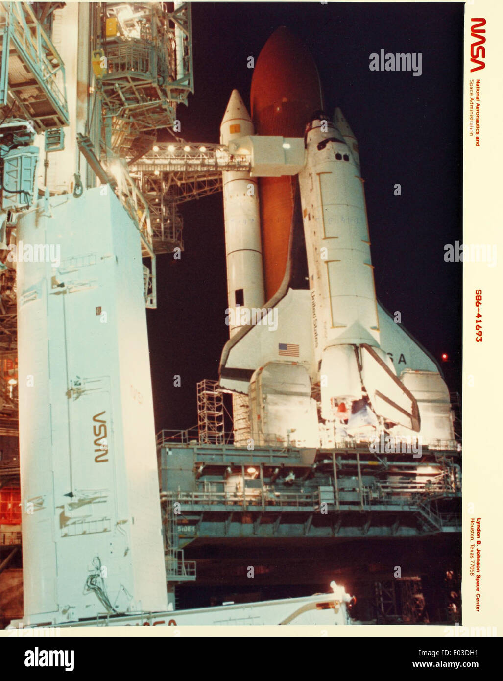 This glossy photo from NASA depicts a key moment in the Space Shuttle Program, capturing ...