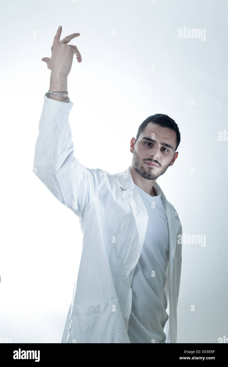 A young researcher wearing a lab coat on white background Stock Photo ...
