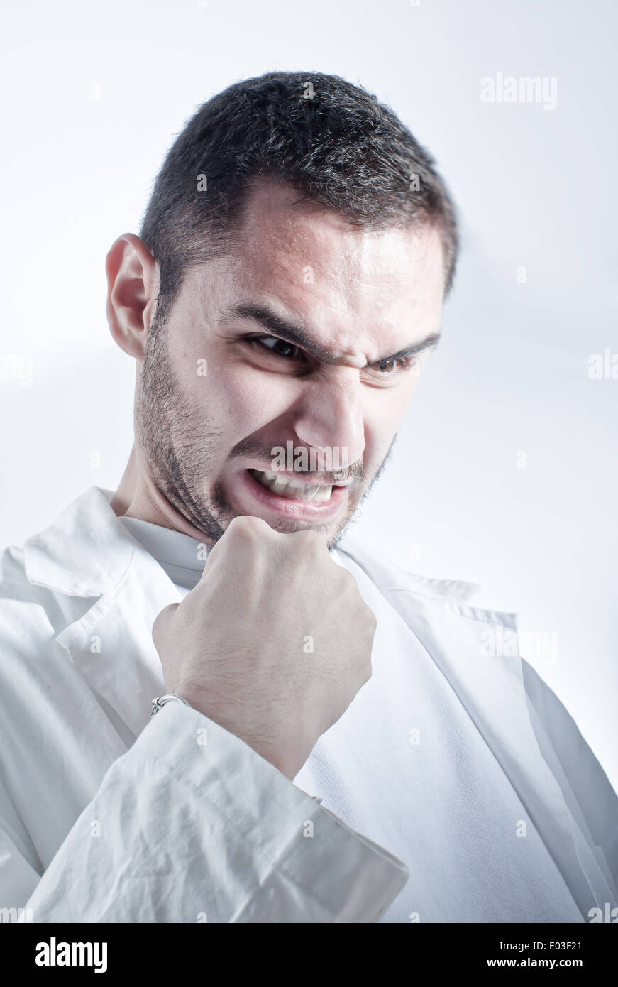 Angry researcher/doctor wearing a lab coat on white background Stock ...