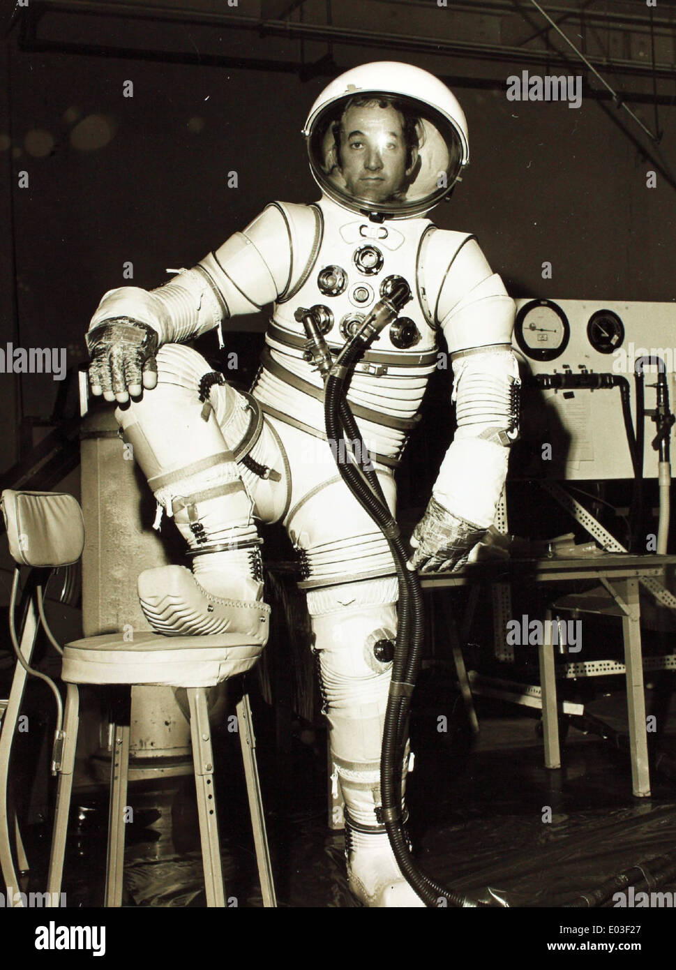 This glossy photograph showcases NASA space suits, which are a vital ...