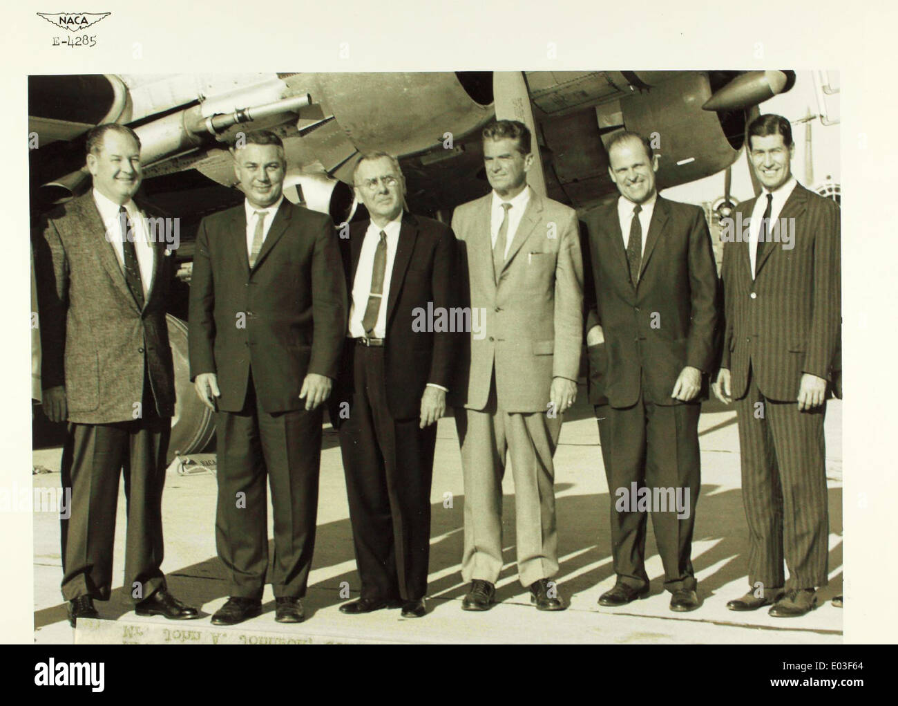 This glossy photo features NASA personnel, showcasing the team of ...