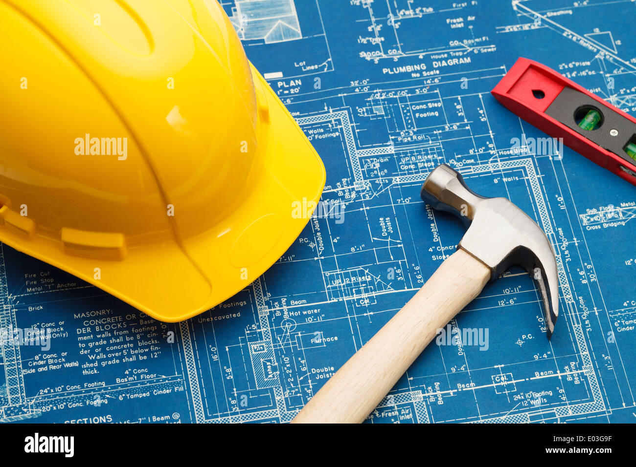 Construction Tools and Blueprints with Yellow Hard Hat Stock Photo - Alamy