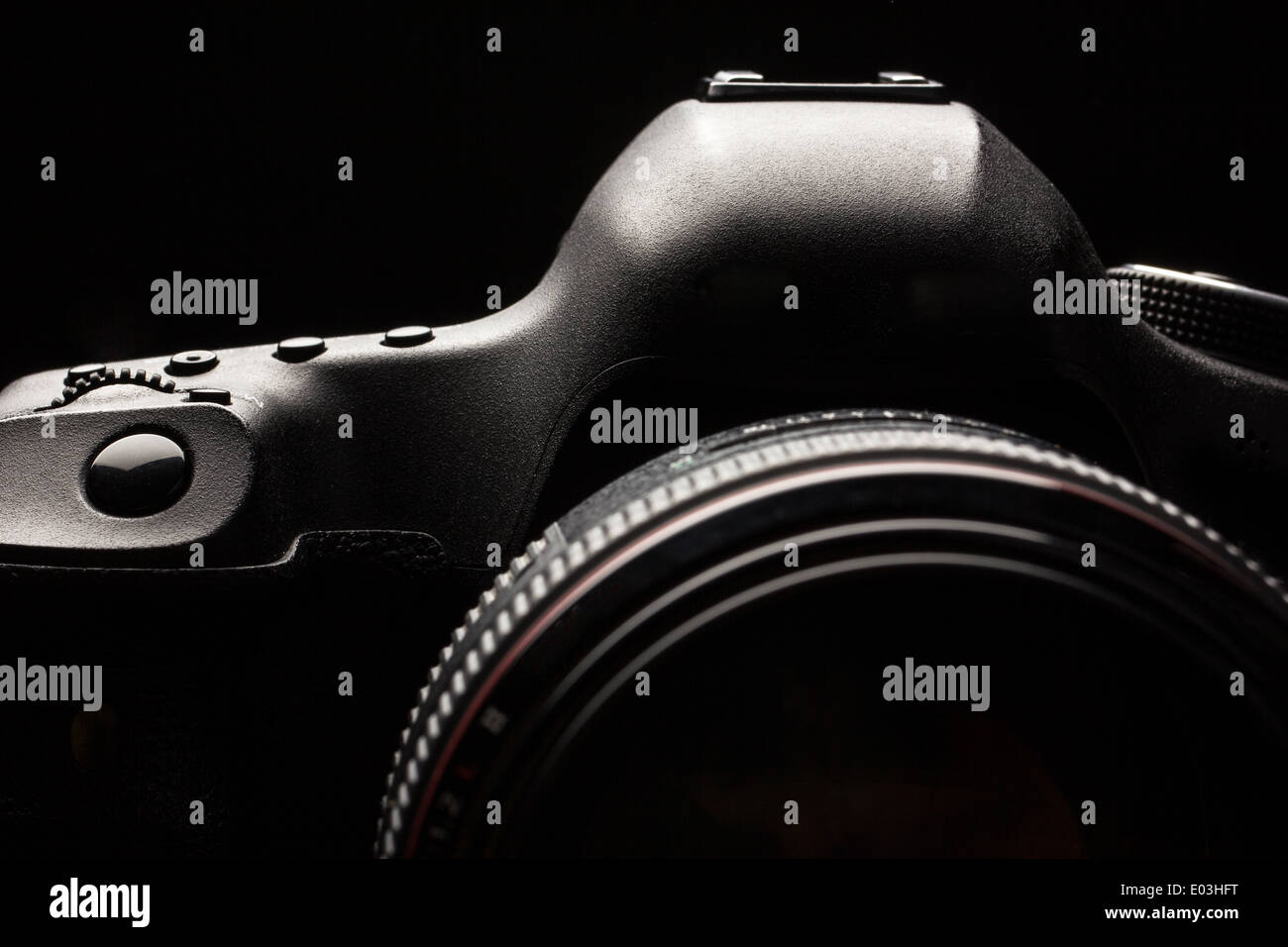 Professional modern DSLR camera low key image - Modern DSLR camera with ...