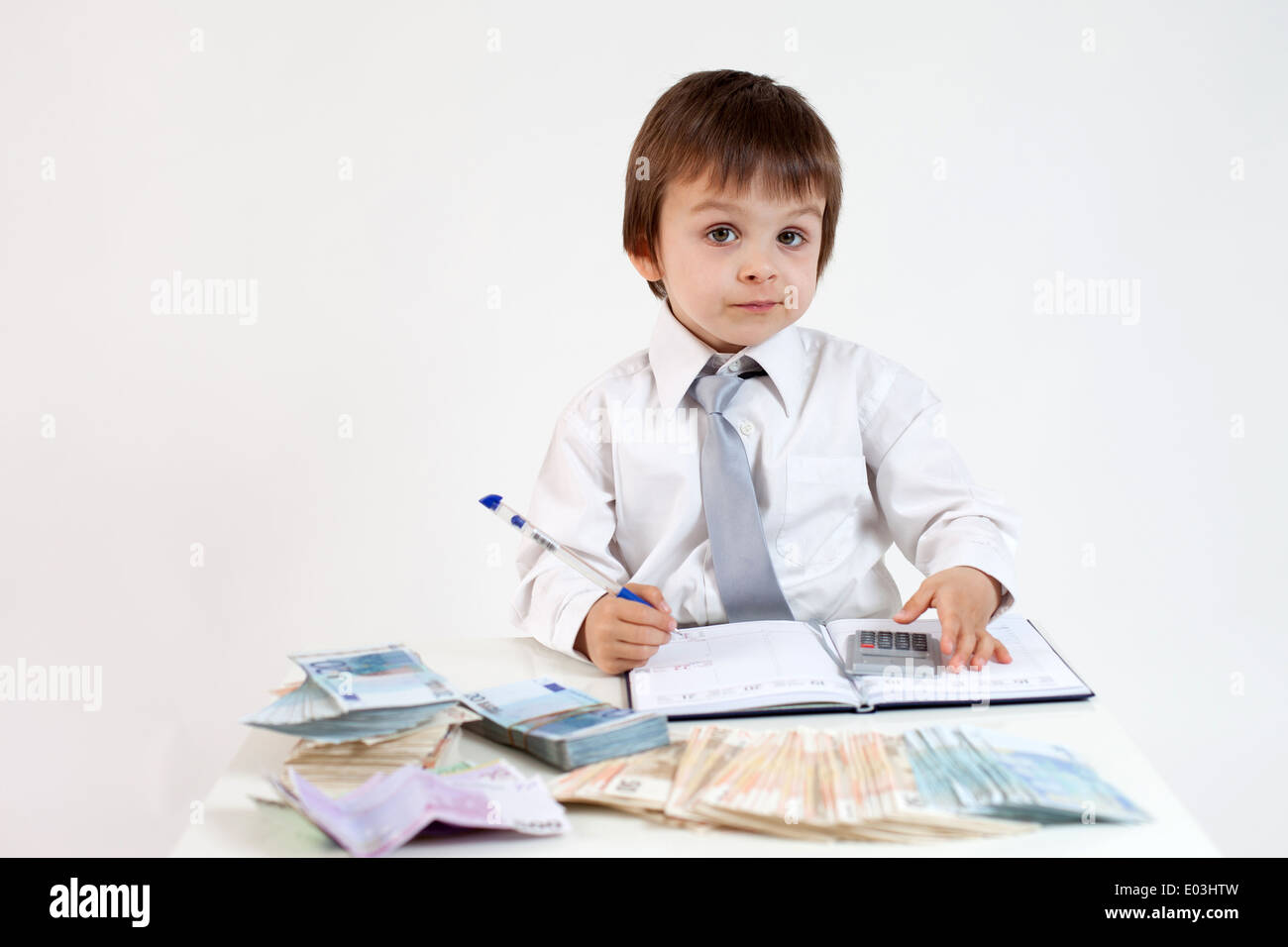Young man, counting money and taking notes Stock Photo - Alamy