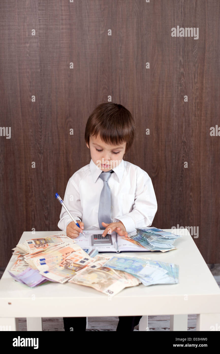 Young man, counting money and taking notes Stock Photo - Alamy