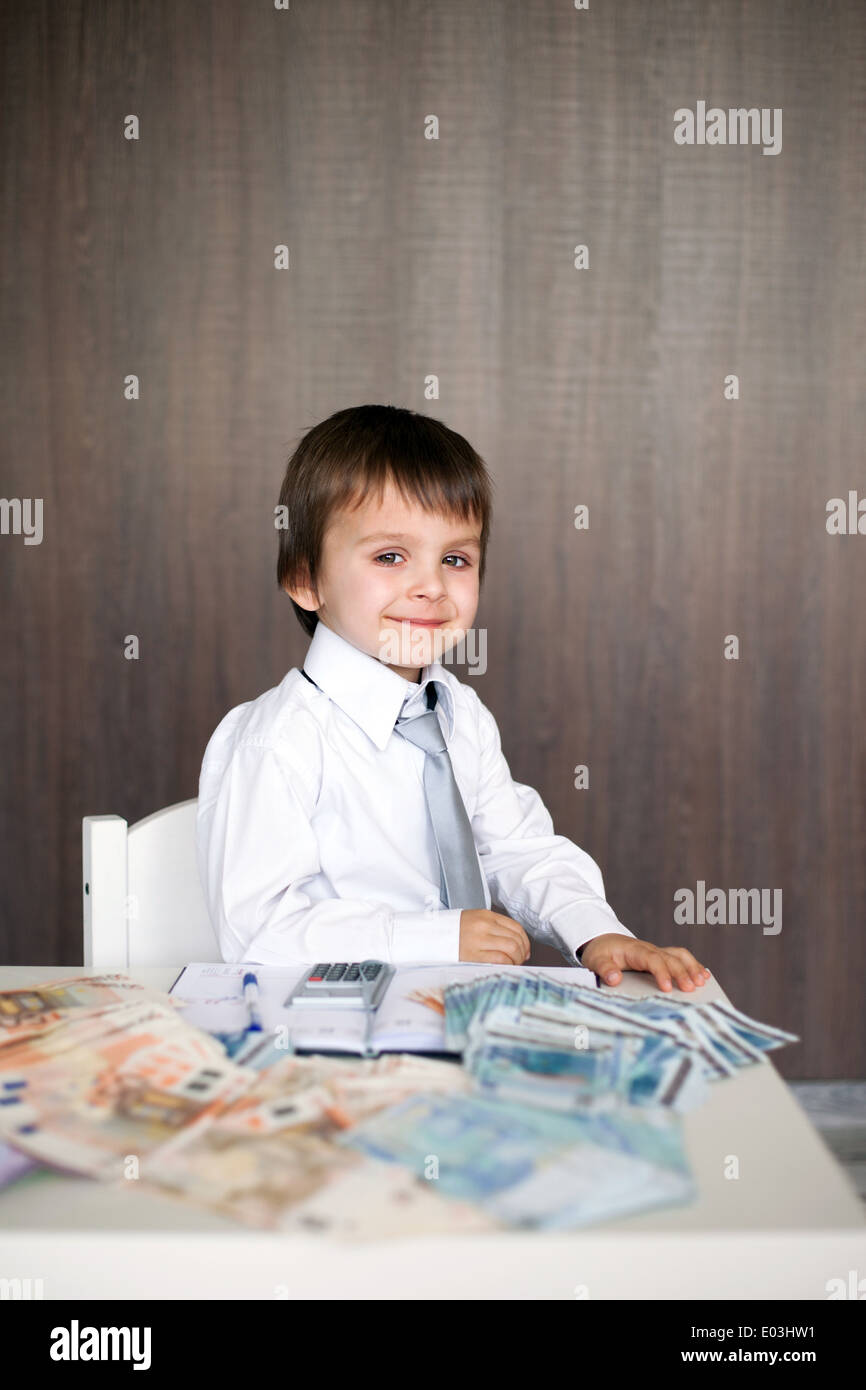 Young man, counting money and taking notes Stock Photo - Alamy