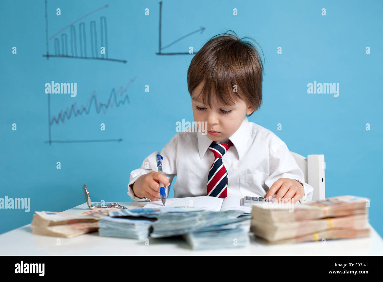 Boy Counting Money Table High Resolution Stock Photography and Images ...