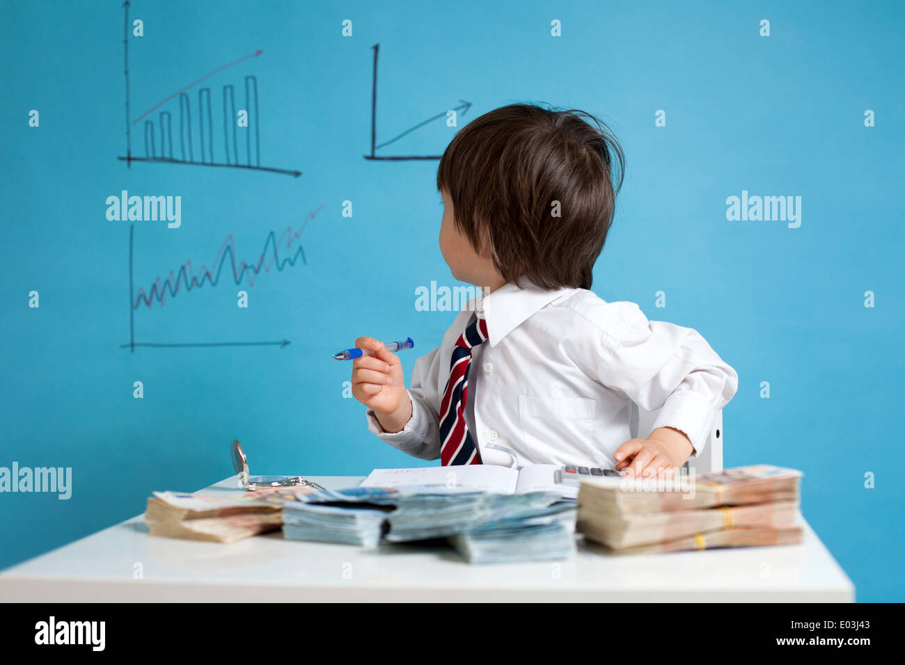 Boy Counting Money Table High Resolution Stock Photography and Images ...