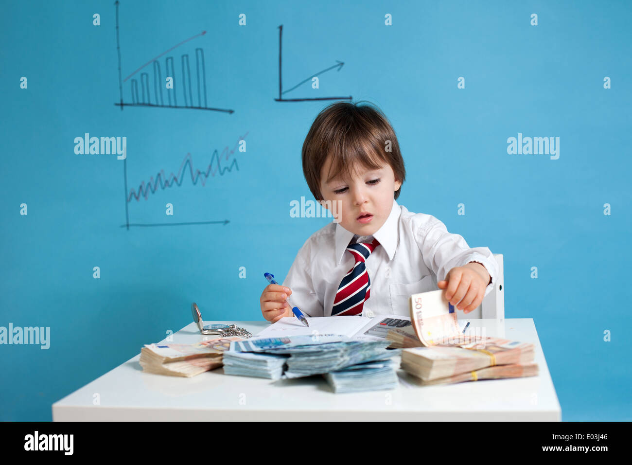 Boy Counting Money Table High Resolution Stock Photography and Images ...