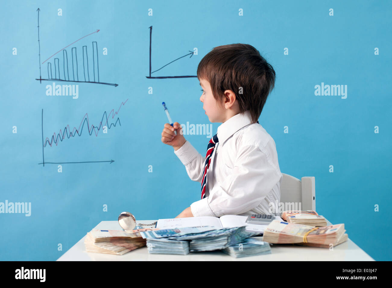 Boy Counting Money Table High Resolution Stock Photography and Images ...