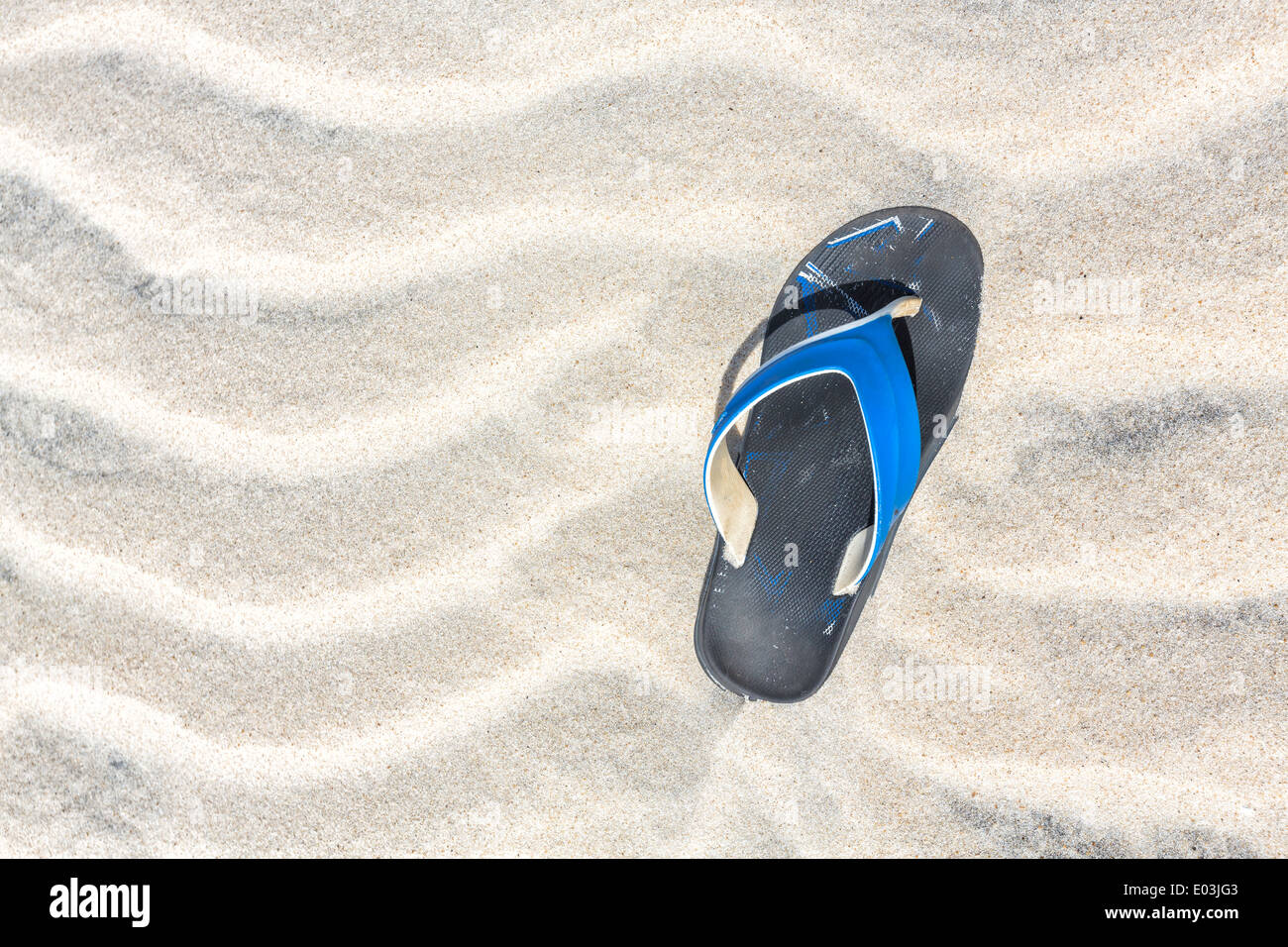 Flip flop on the beach sand Stock Photo - Alamy