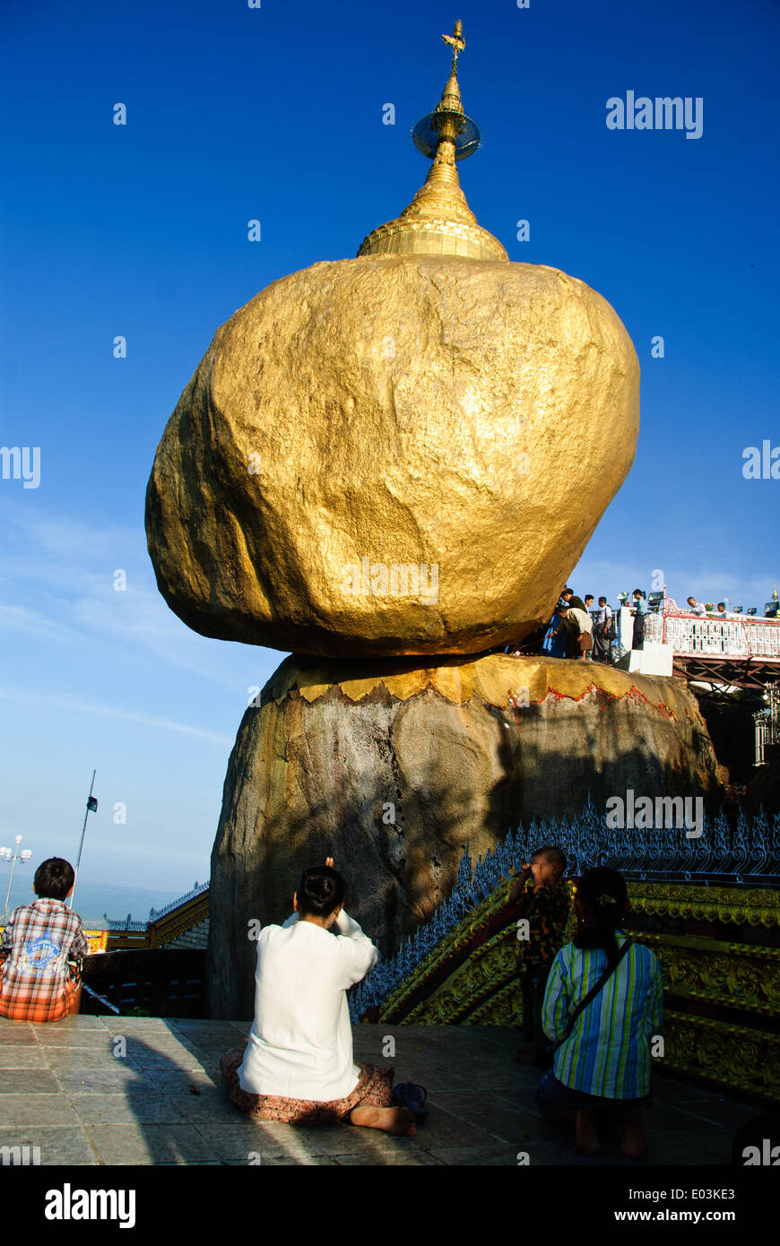 Burmese people paying homage to the sacred Golden Pagoda Stock Photo ...