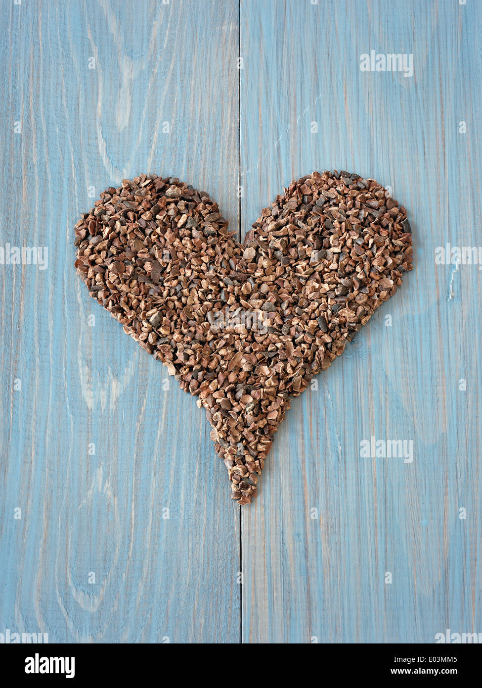 Cacao nibs shaped in heart symbol Stock Photo - Alamy