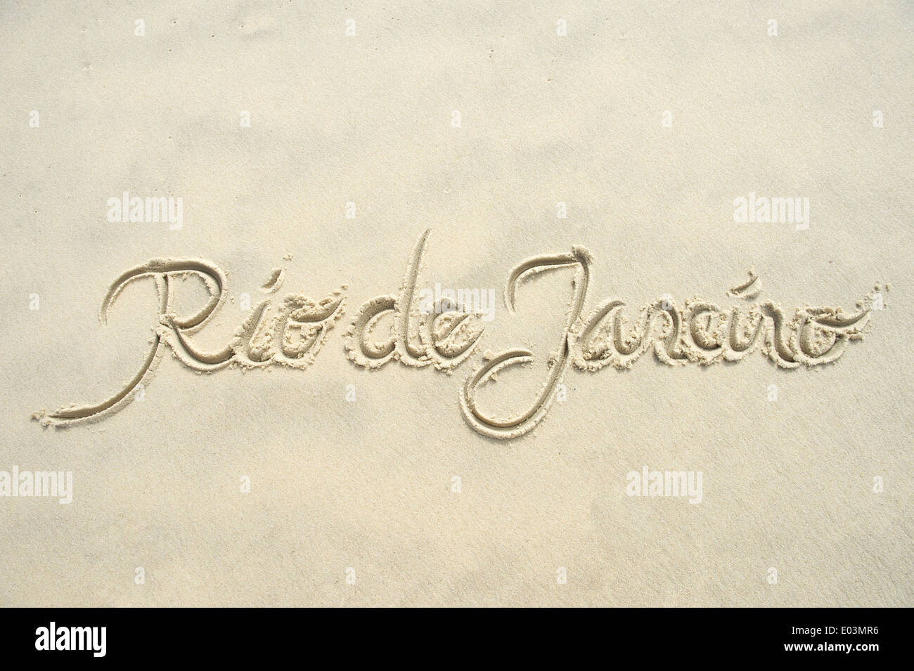 Rio de Janeiro message handwritten on sand beach Stock Photo - Alamy