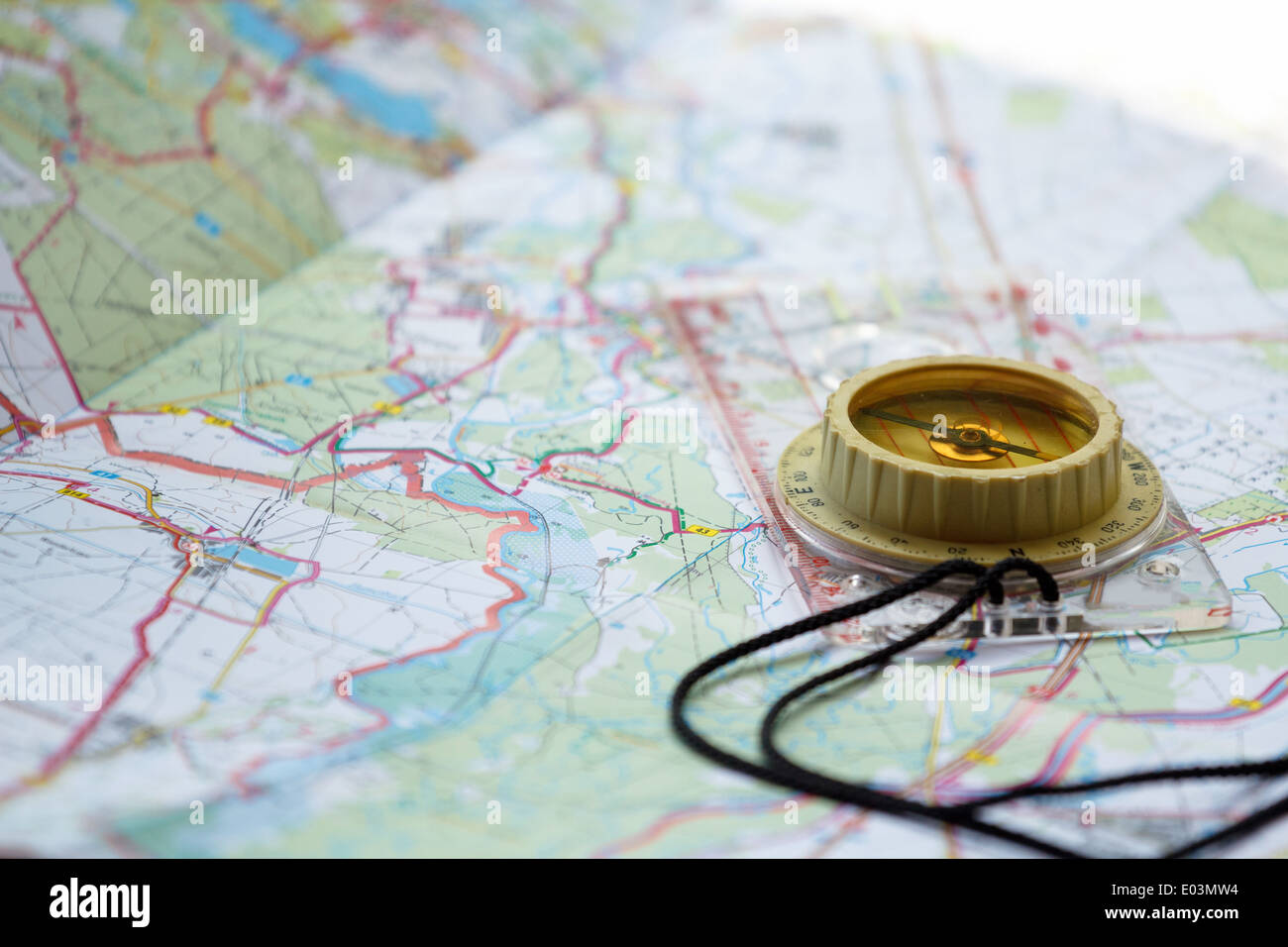 old touristic handheld compass on detailed territory map Stock Photo ...