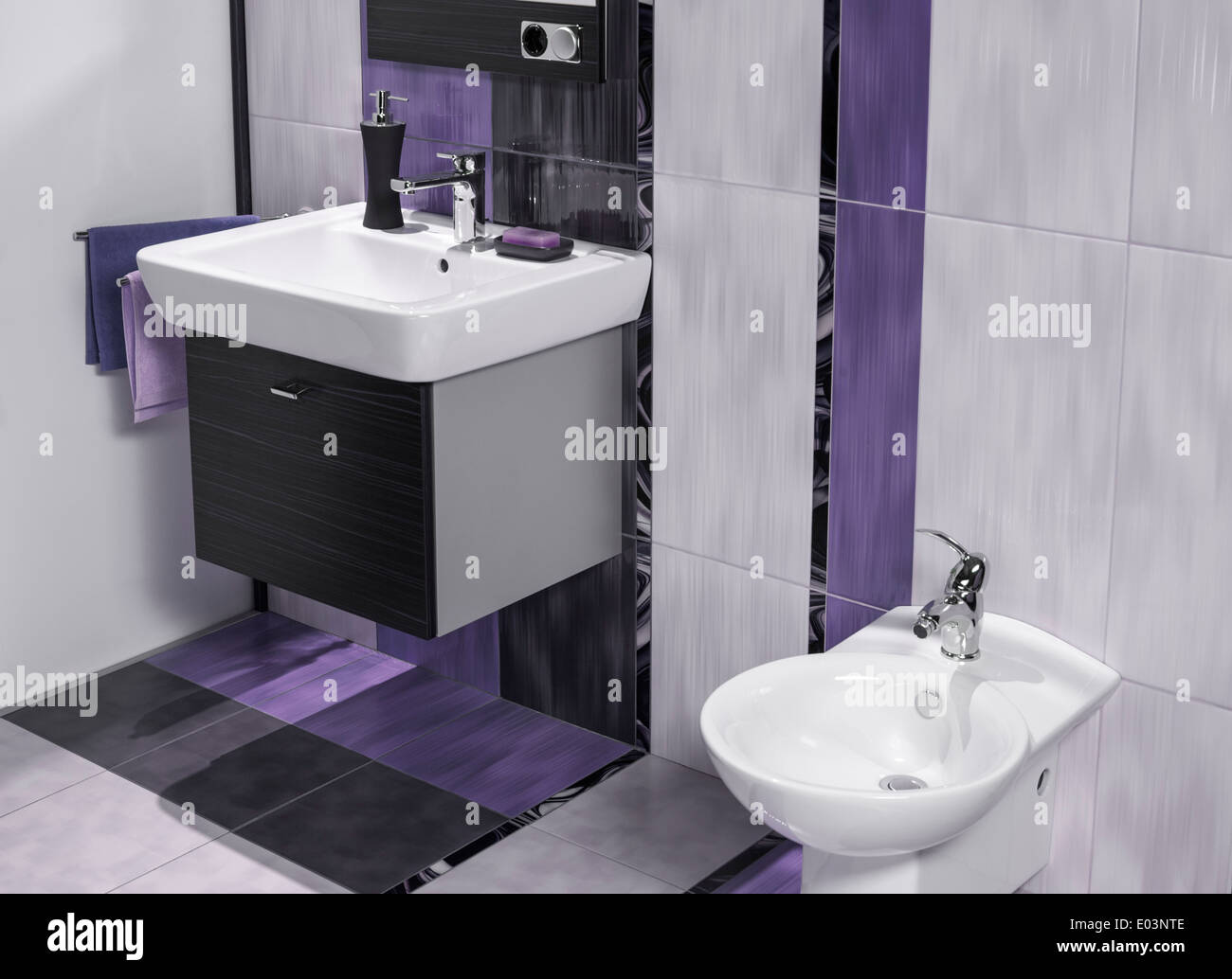 detail of a luxurious bathroom with sink and bidet in three colors ...