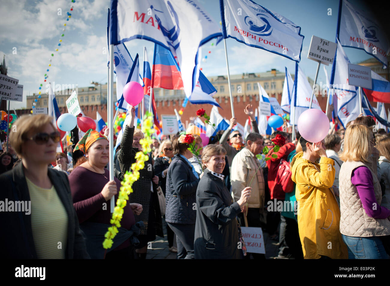 Moscow. 1st May, 2014. People attend a parade marking the International ...