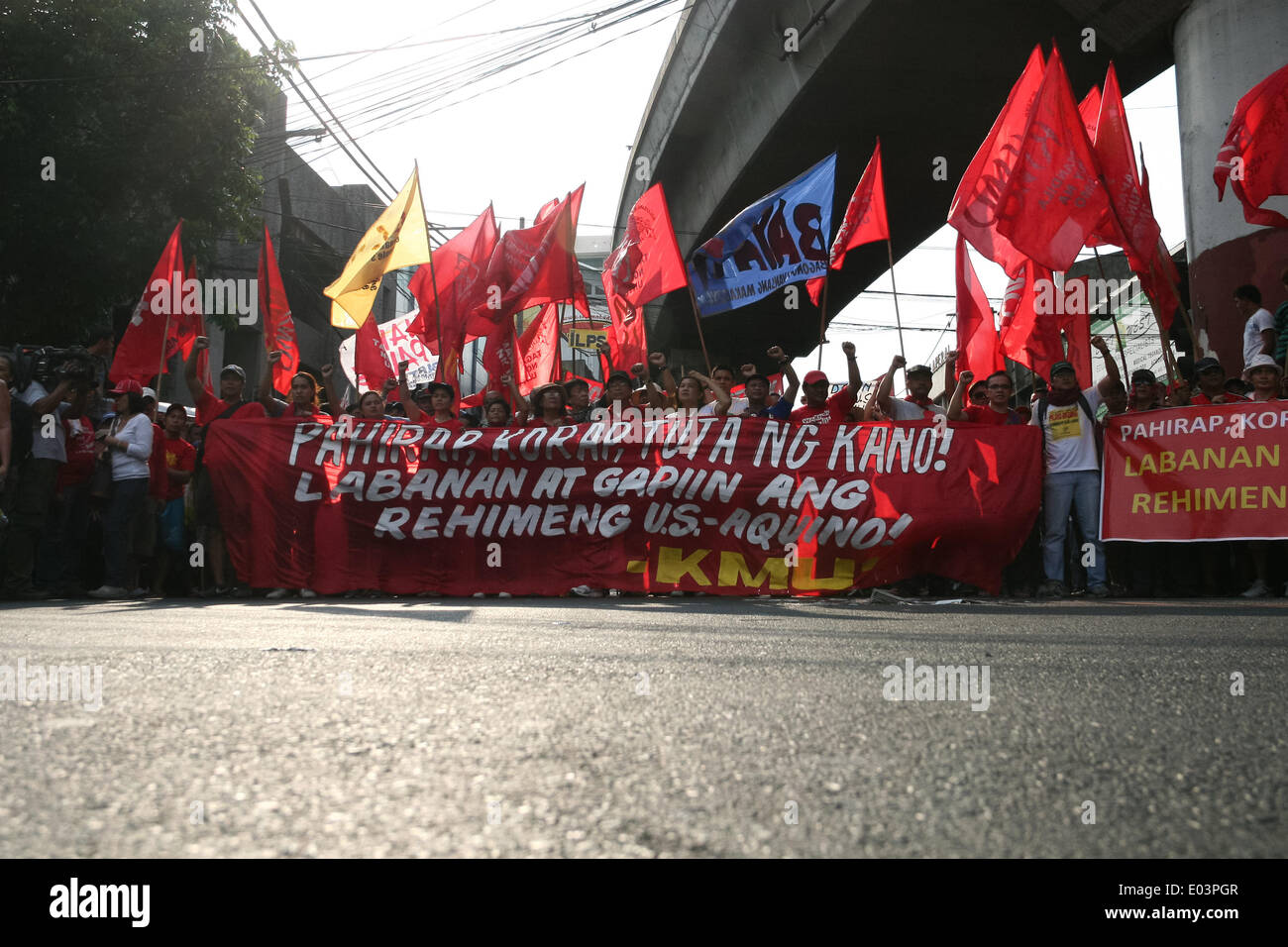 Manila, Philippines. 01st May, 2014. Protesters raise their fists as ...