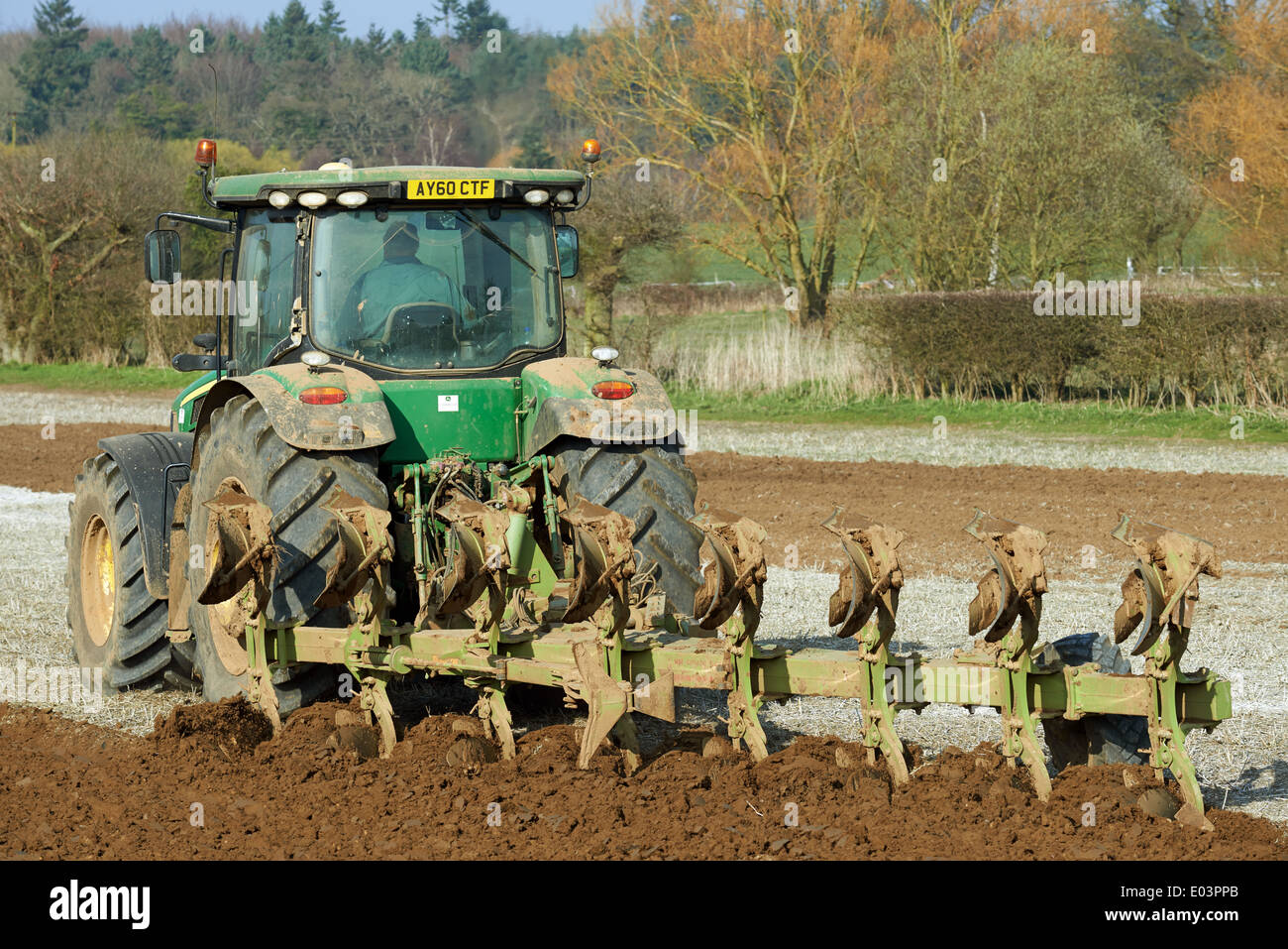 Tractor and plough, Suffolk, UK Stock Photo - Alamy