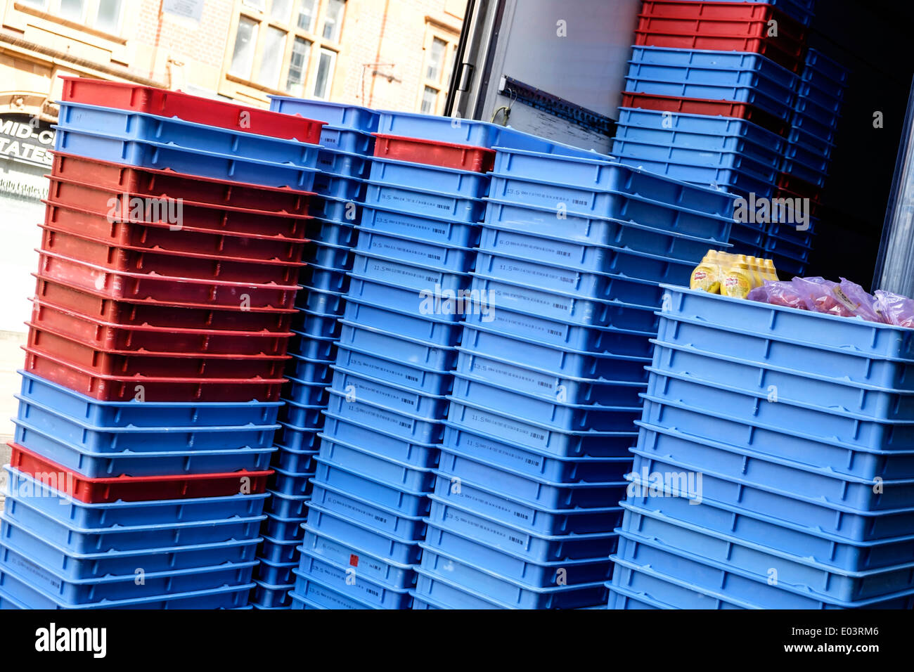 Stack of red and blue boxes on back of delivery truck South Yorkshire ...
