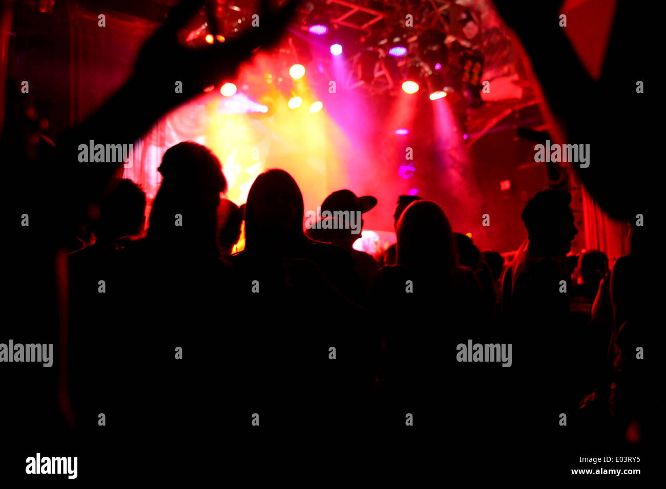 Beautiful dreamy colourful image of a nightclub interior with people ...
