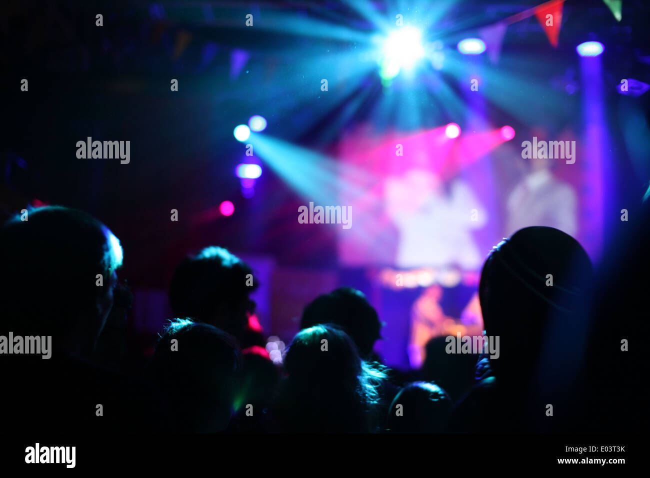 Beautiful dreamy colourful image of a nightclub interior with people ...