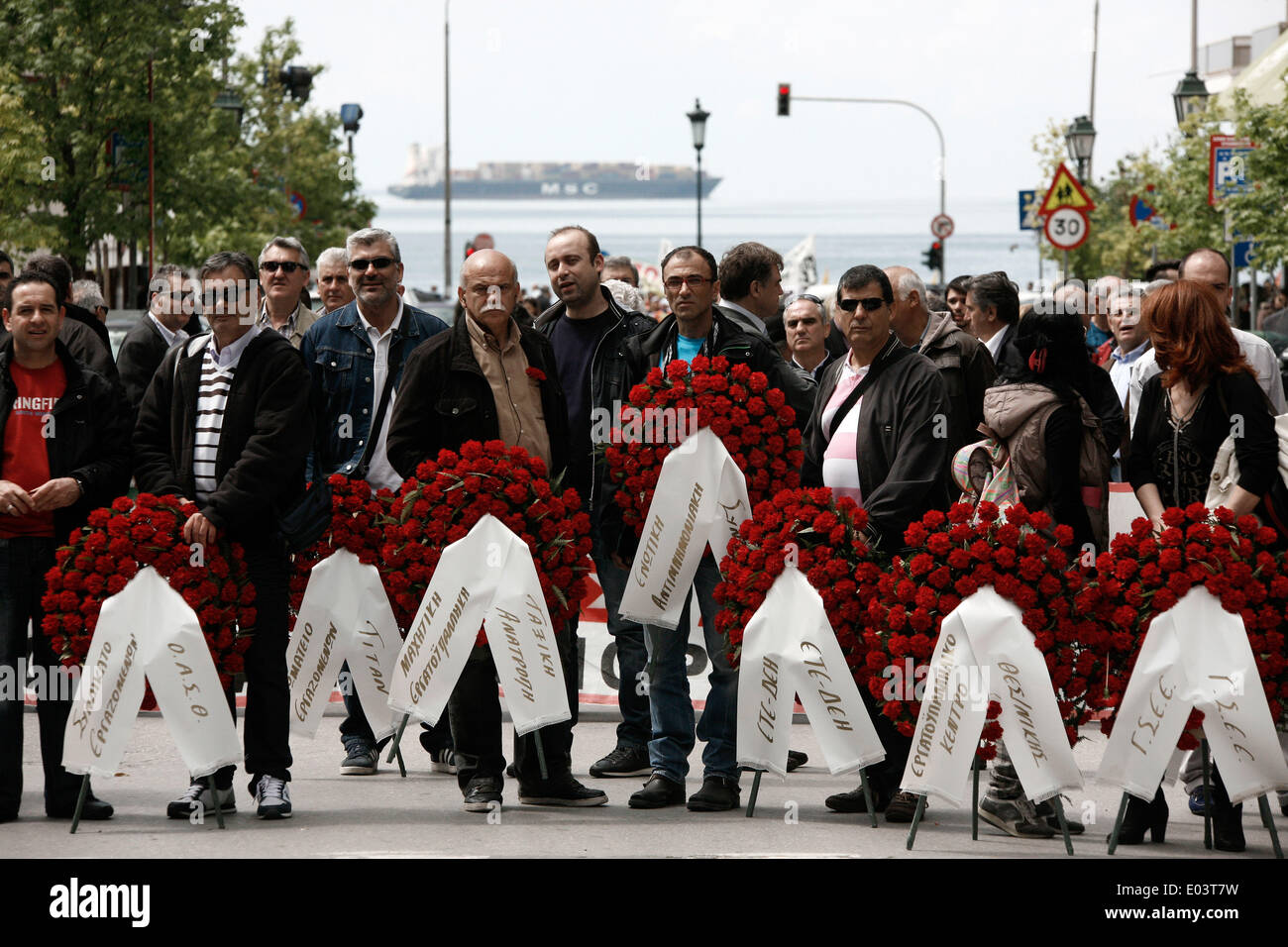 Thessaloniki, Greece. 1st May 2014. Protesters hold carnation wreath ...