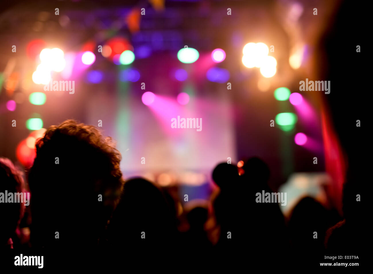 Beautiful dreamy colourful image of a nightclub interior with people ...