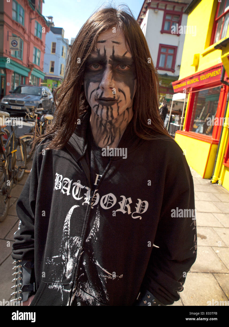 A heavily made up teenage boy who love heavy rock music, in central ...