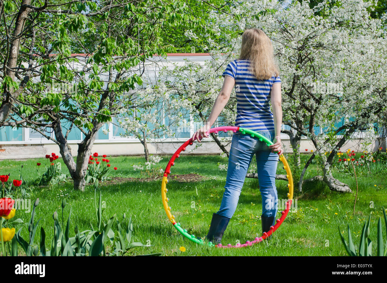 woman hold colorful hula hoop on nature background back view Stock ...