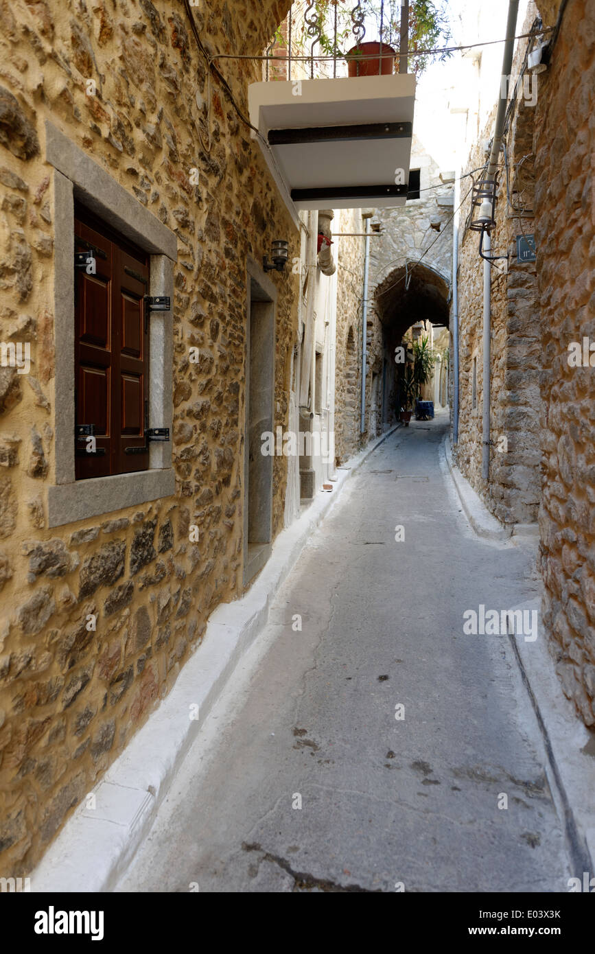 Narrow lane with vaulted arched passageway in medieval town Olympi ...
