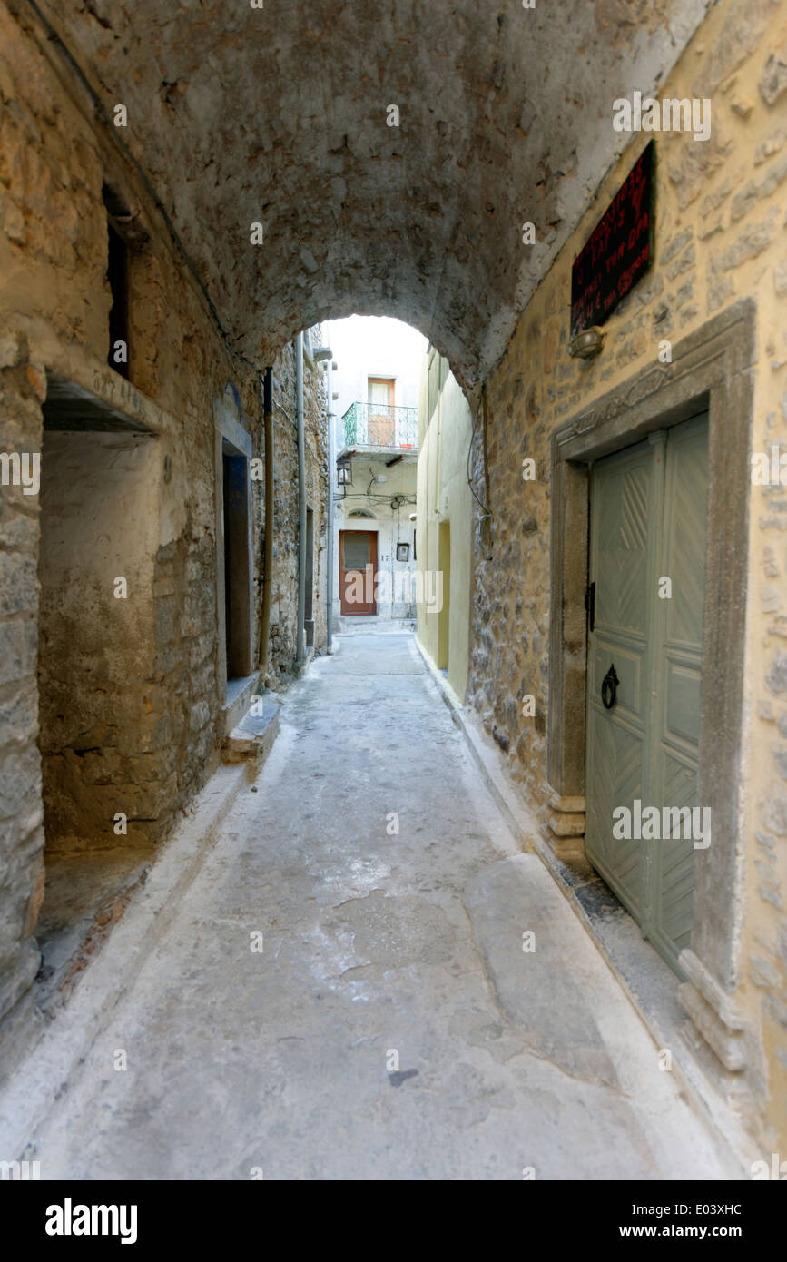 Narrow lane with vaulted arched passageway in medieval town Olympi ...