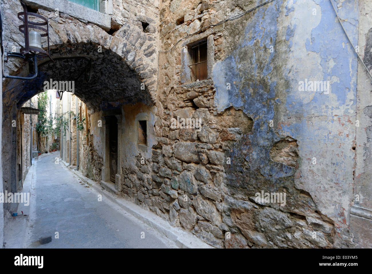 Narrow lane with vaulted arched passageway in medieval town Olympi ...
