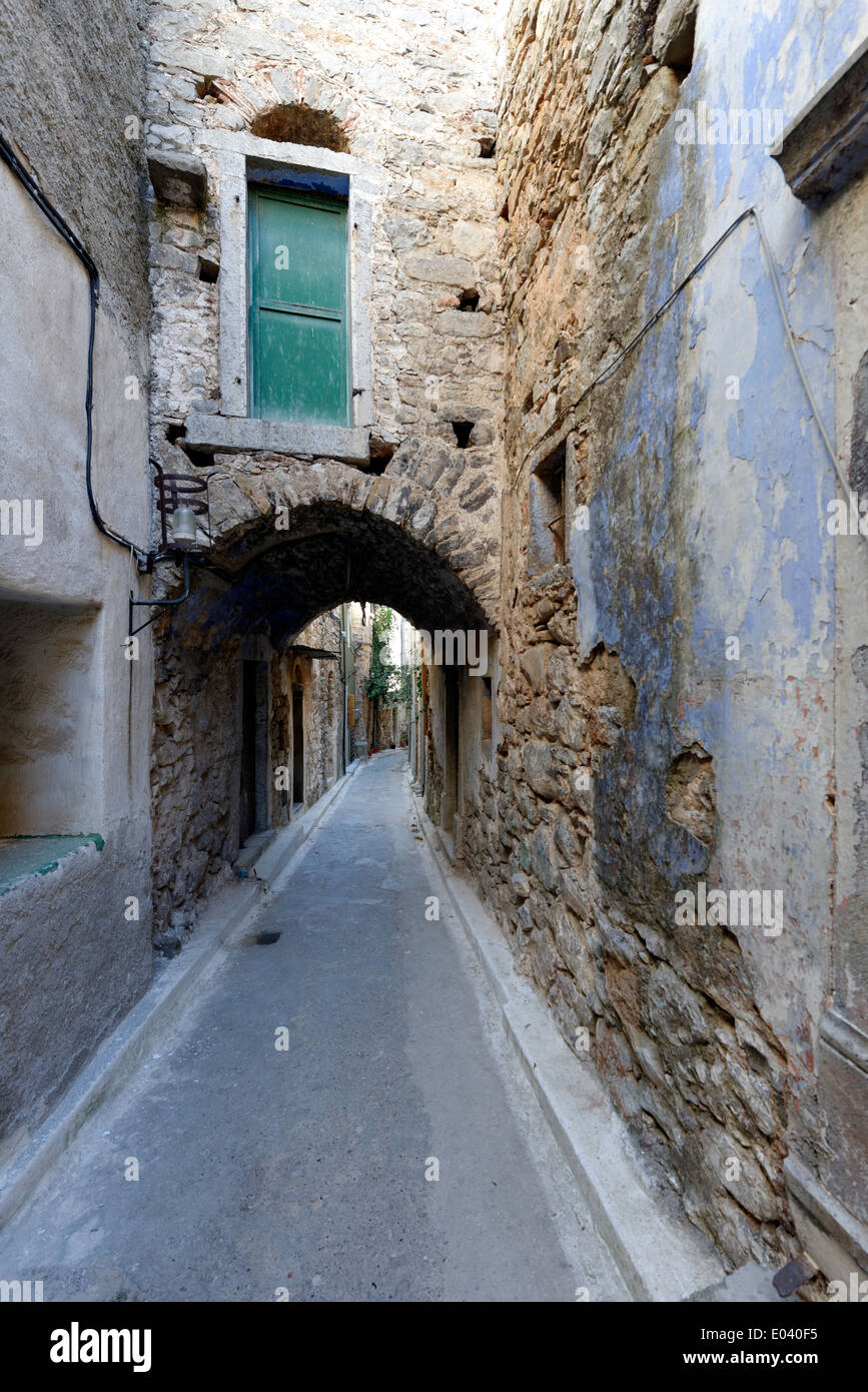 Narrow lane with vaulted arched passageway in medieval town Olympi ...