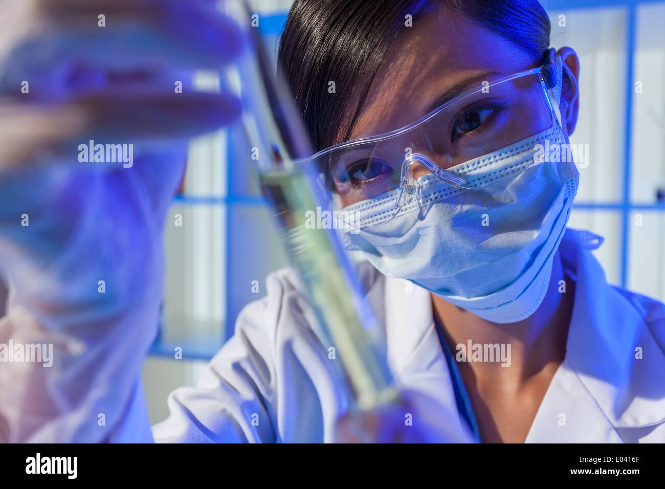 Chinese Asian female medical or scientific researcher or doctor using ...