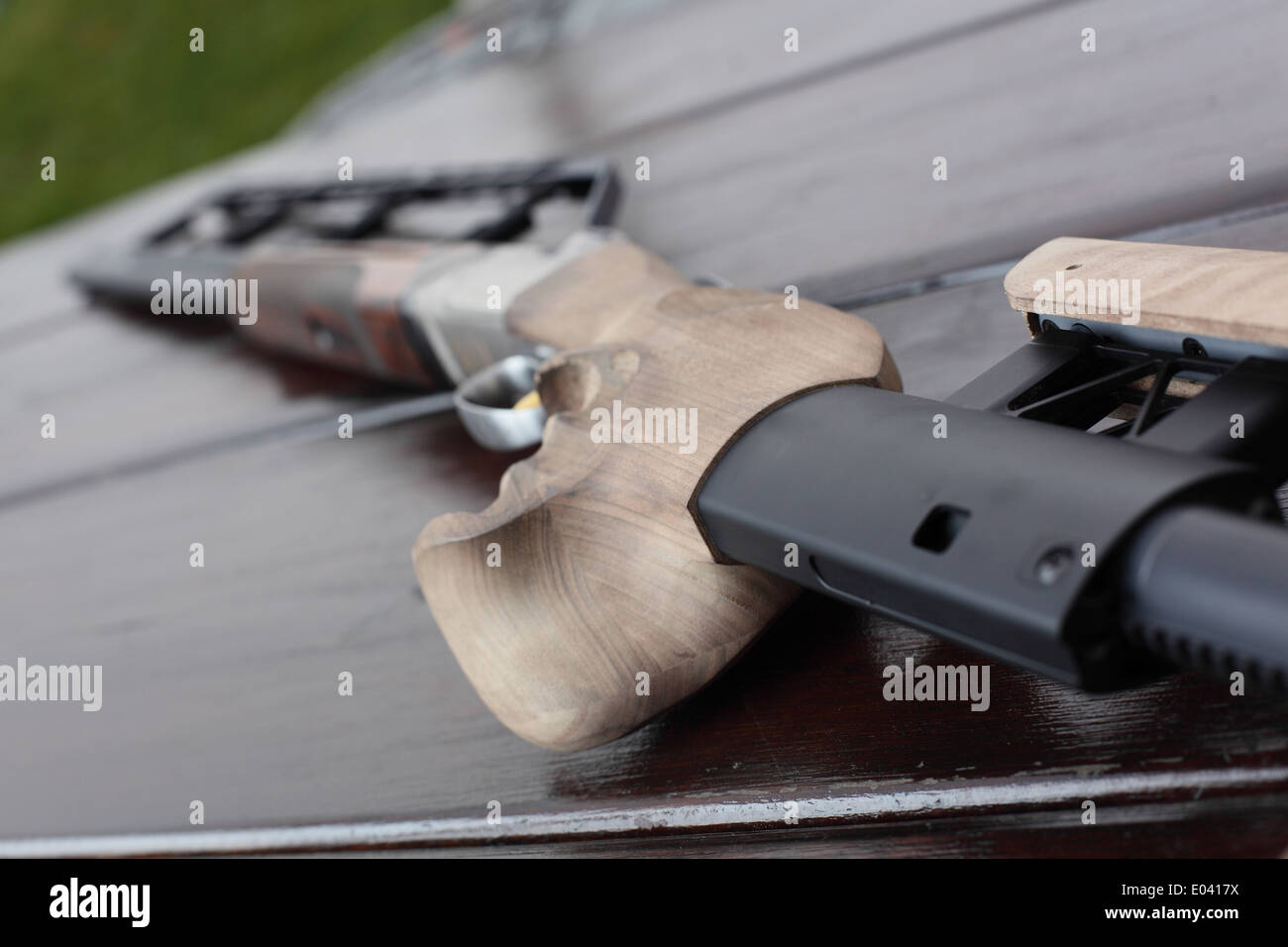 powerful gun with wooden butt and black barrel Stock Photo - Alamy