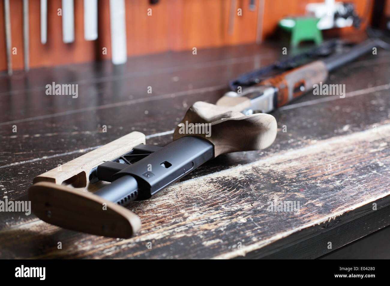 powerful gun with wooden butt and black Stock Photo - Alamy