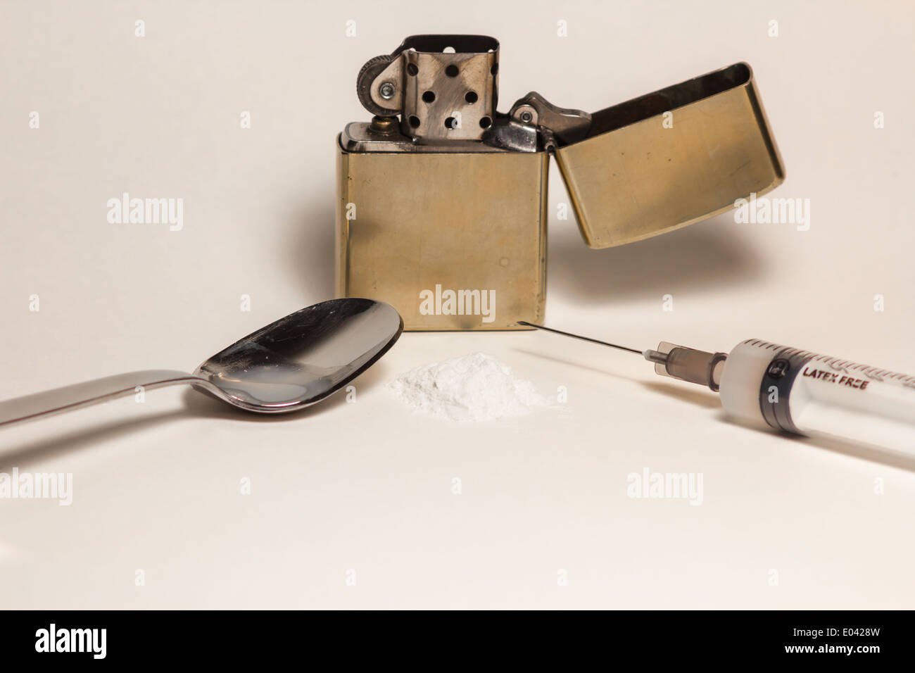 Lighter, spoon and heroin, with a syringe for the injection Stock Photo ...