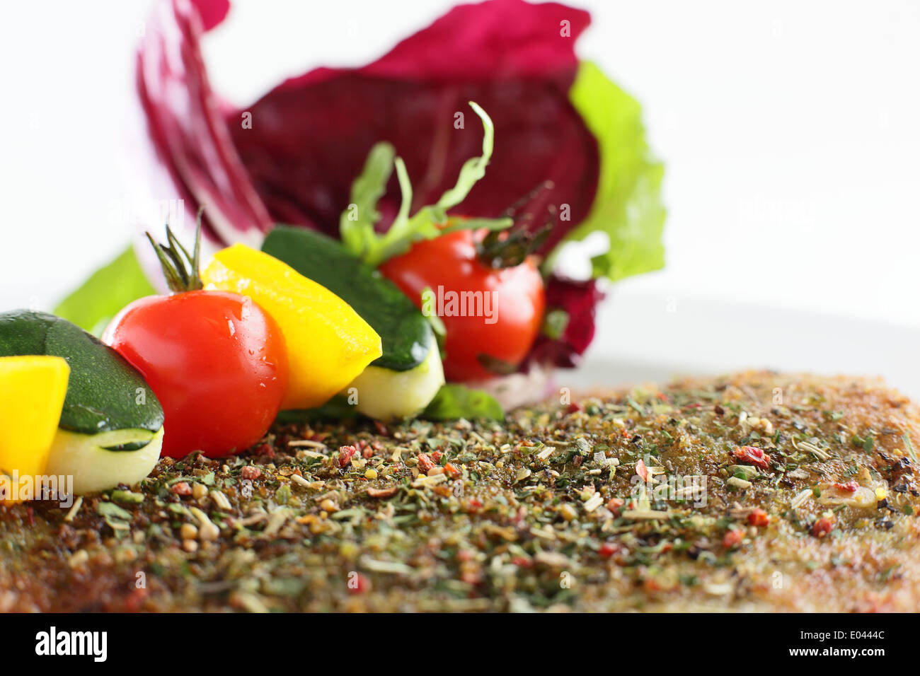 fresh and tasty peaces of meat with garnish Stock Photo - Alamy