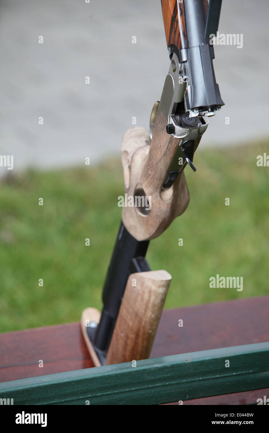 powerful gun with wooden butt and black Stock Photo - Alamy