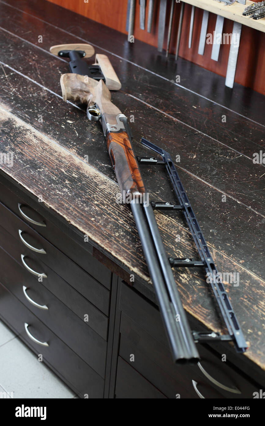 powerful gun with wooden butt and black Stock Photo - Alamy