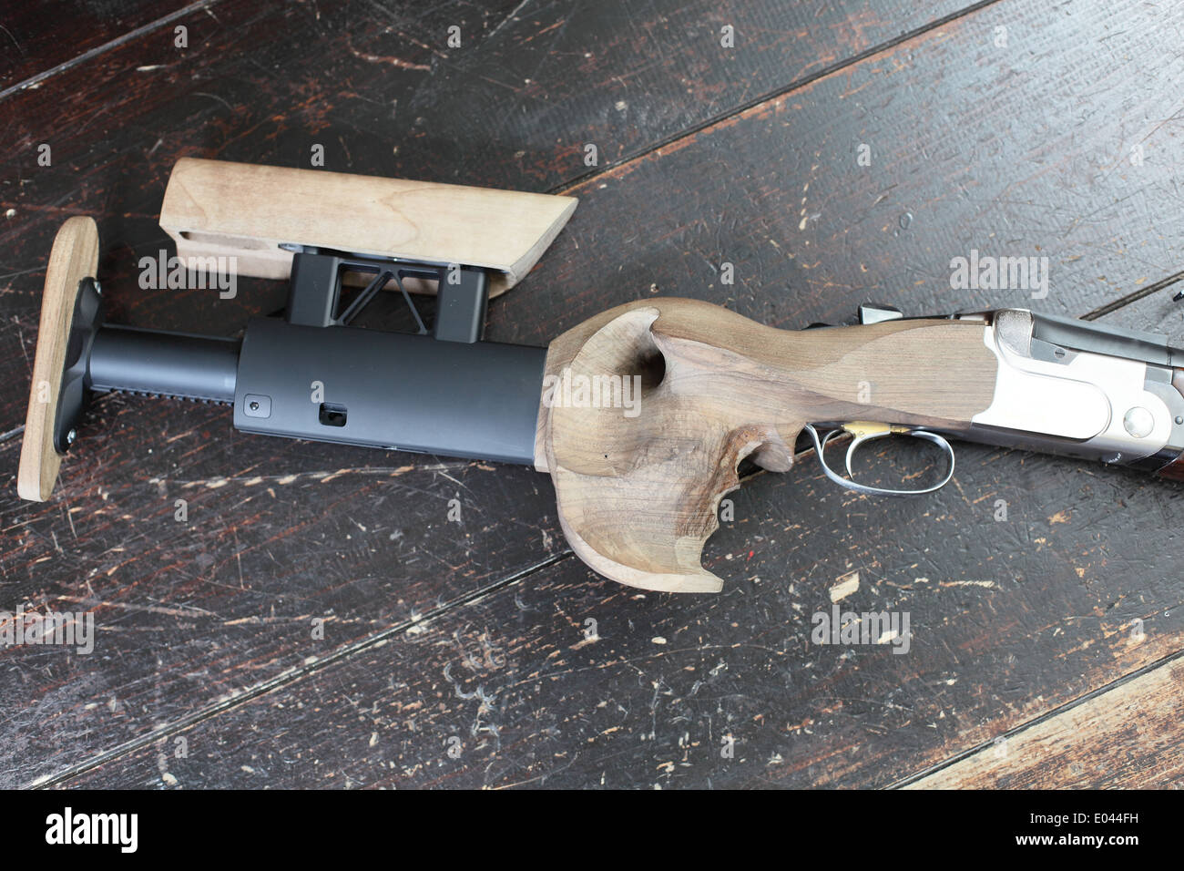 powerful gun with wooden butt and black Stock Photo - Alamy