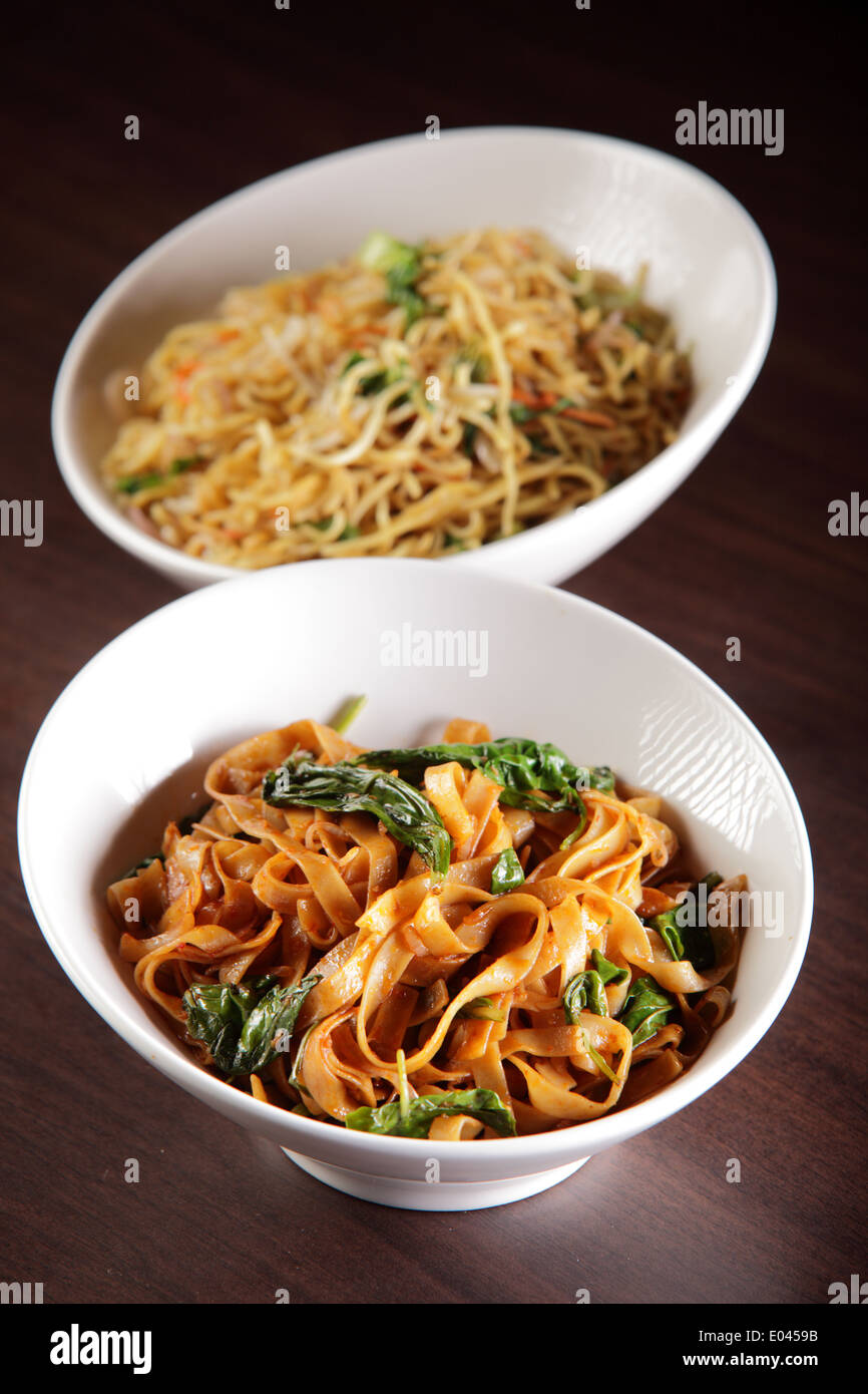 tasty and hot chinese spaghetti with garnish Stock Photo - Alamy