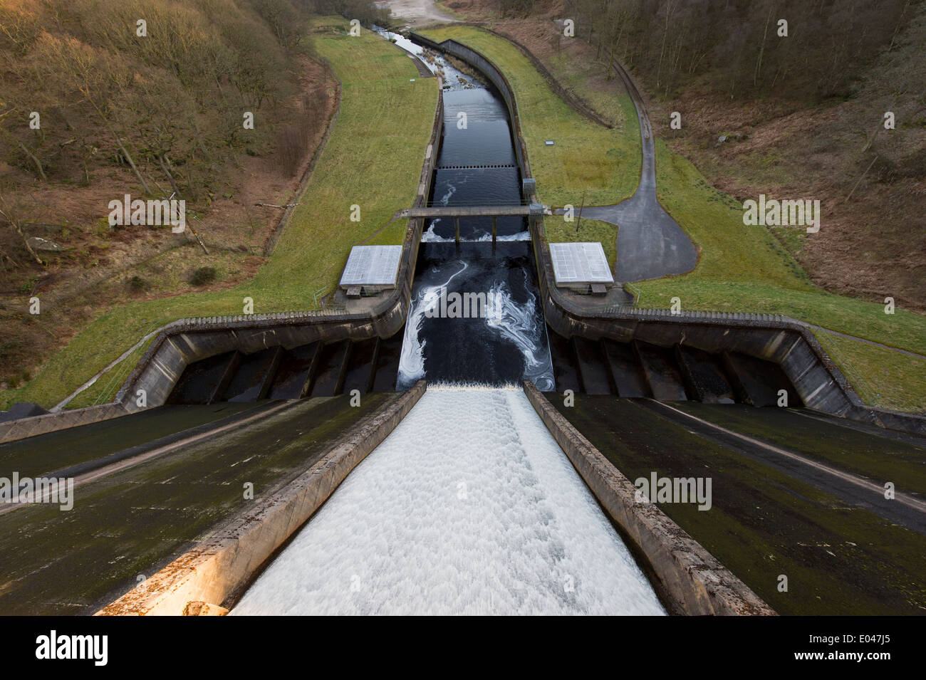 View from top of high, steep-sided, concrete dam at Thruscross ...