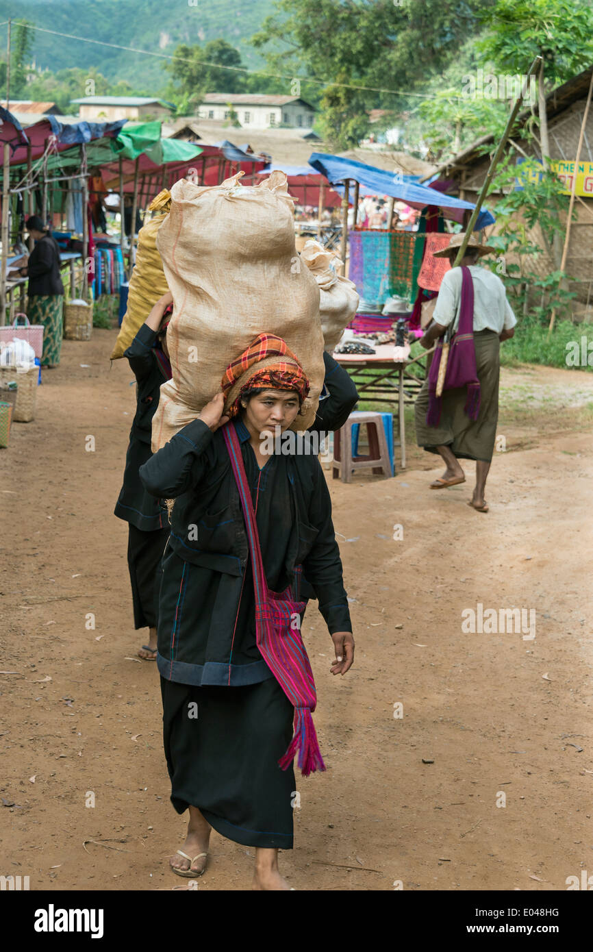 Woman Carrying Heavy Load