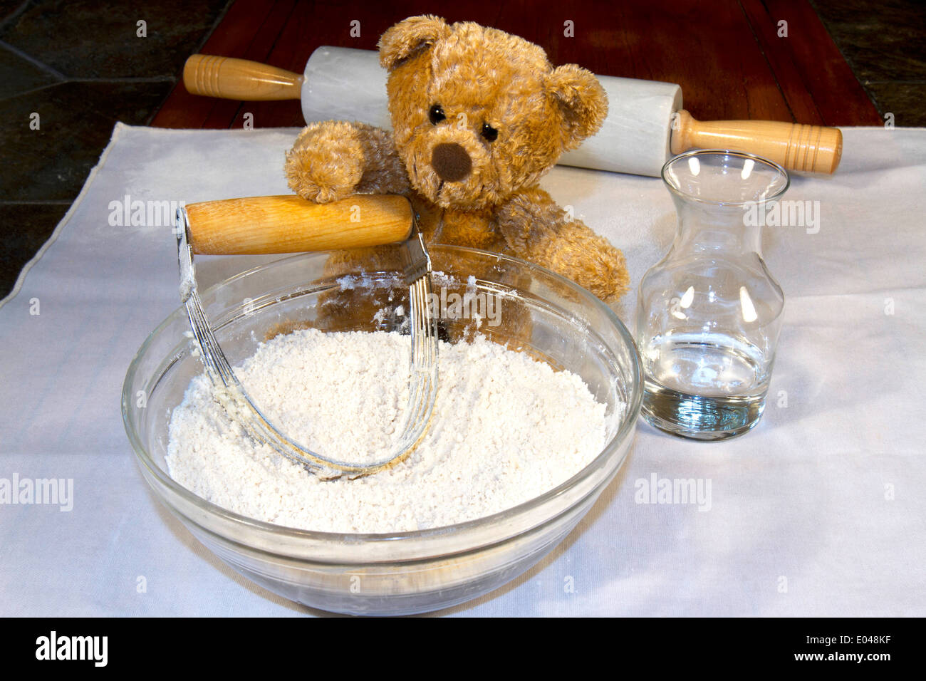 Teddy bear chef working a pie dough Stock Photo - Alamy